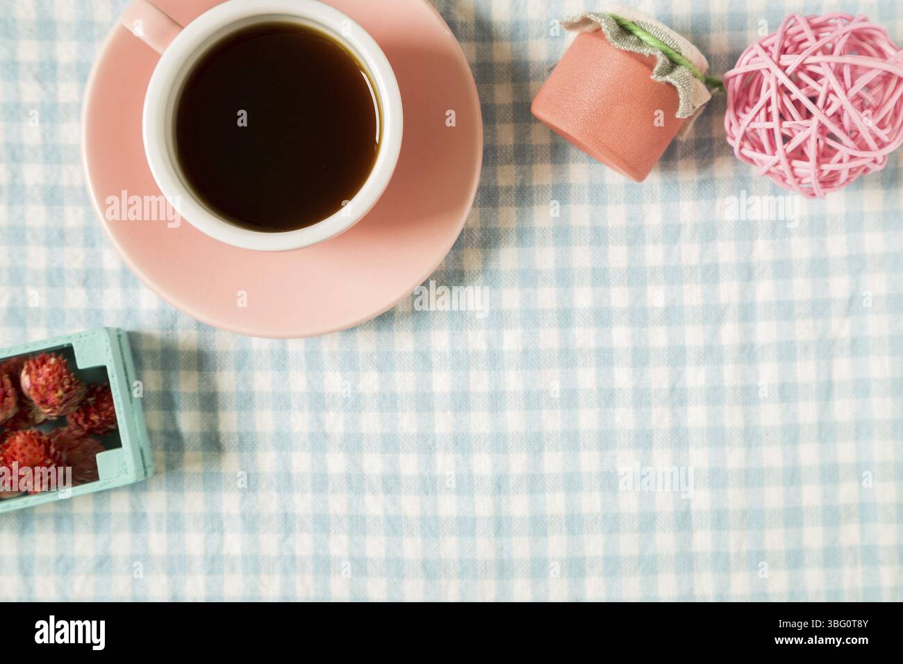 Coffee and ornaments on check pattern fabric background Stock Photo - Alamy