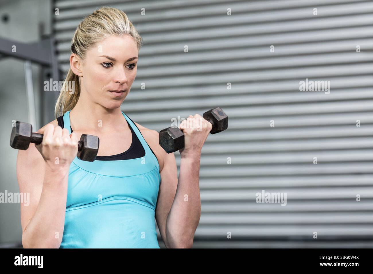 Enthusiast lifting dumbbells in bicep hi-res stock photography and ...