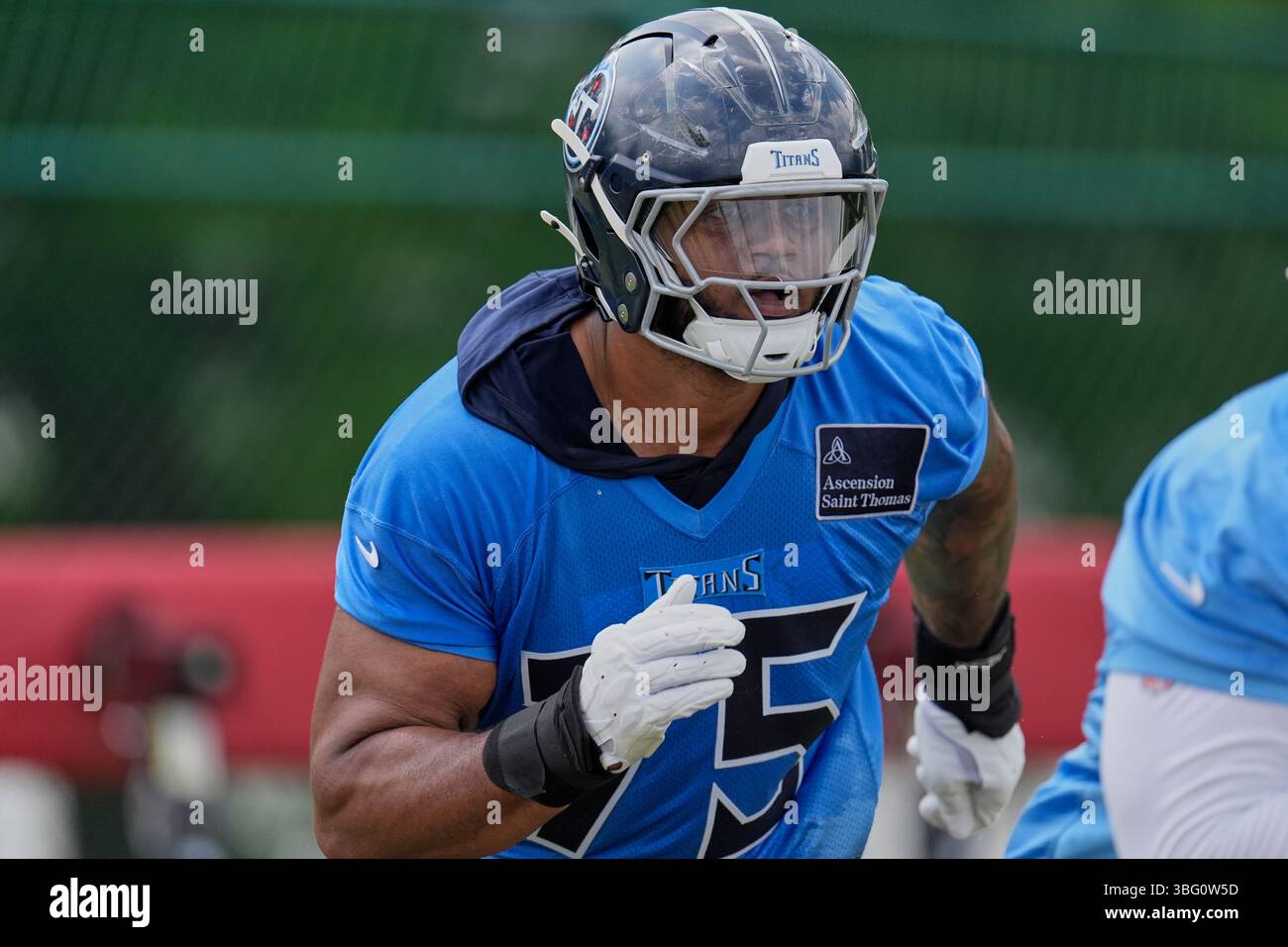 Tennessee Titans offensive tackle Dan Moore Jr. (75) runs through a ...