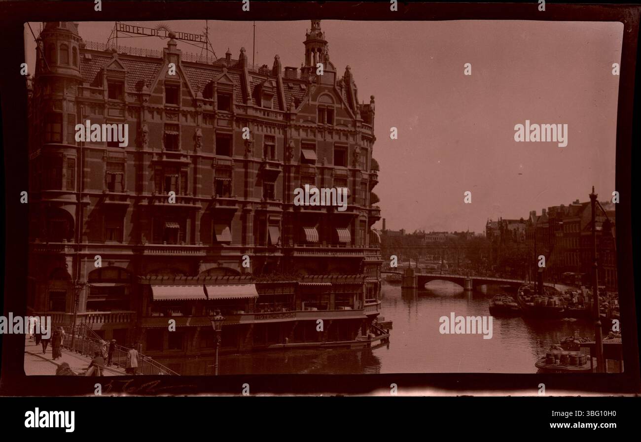 Pedestrians walk across a bridge outside the Hotel De L'Europe in ...