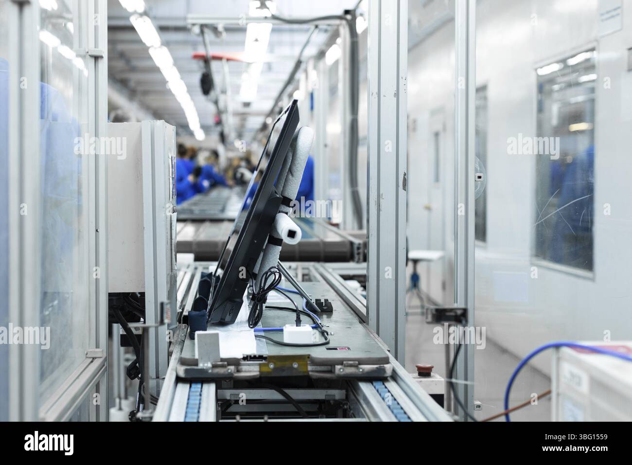 Conveyor for the production of television sets. Testing TVs in the ...