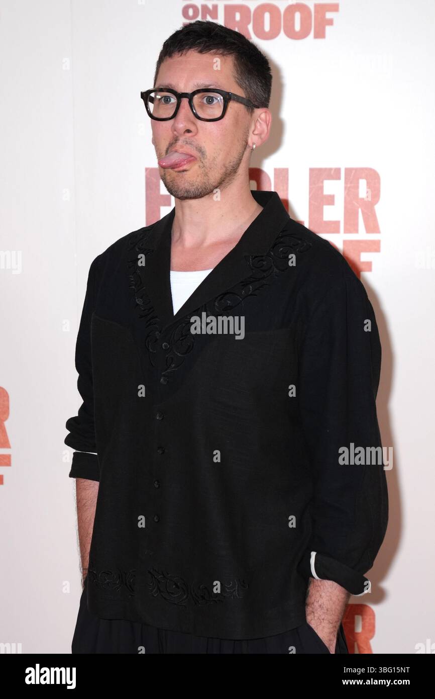 Tom Scutt sticking his tongue out whilst attending the press night of ...