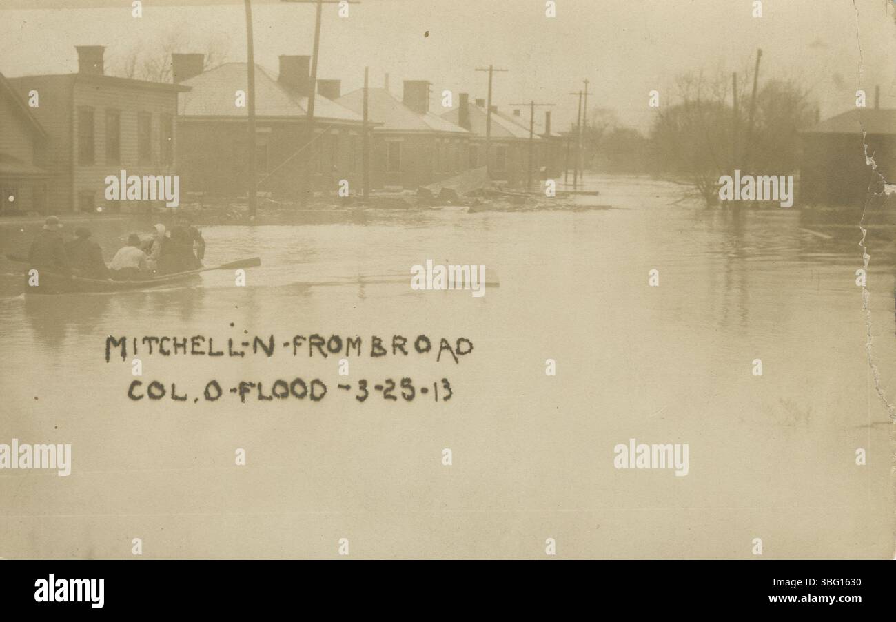 This 1913 black-and-white photographic postcard depicts people in a ...