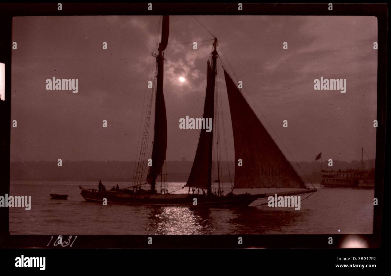 A sailboat is pictured in New York Harbor on the Hudson River in 1913 ...