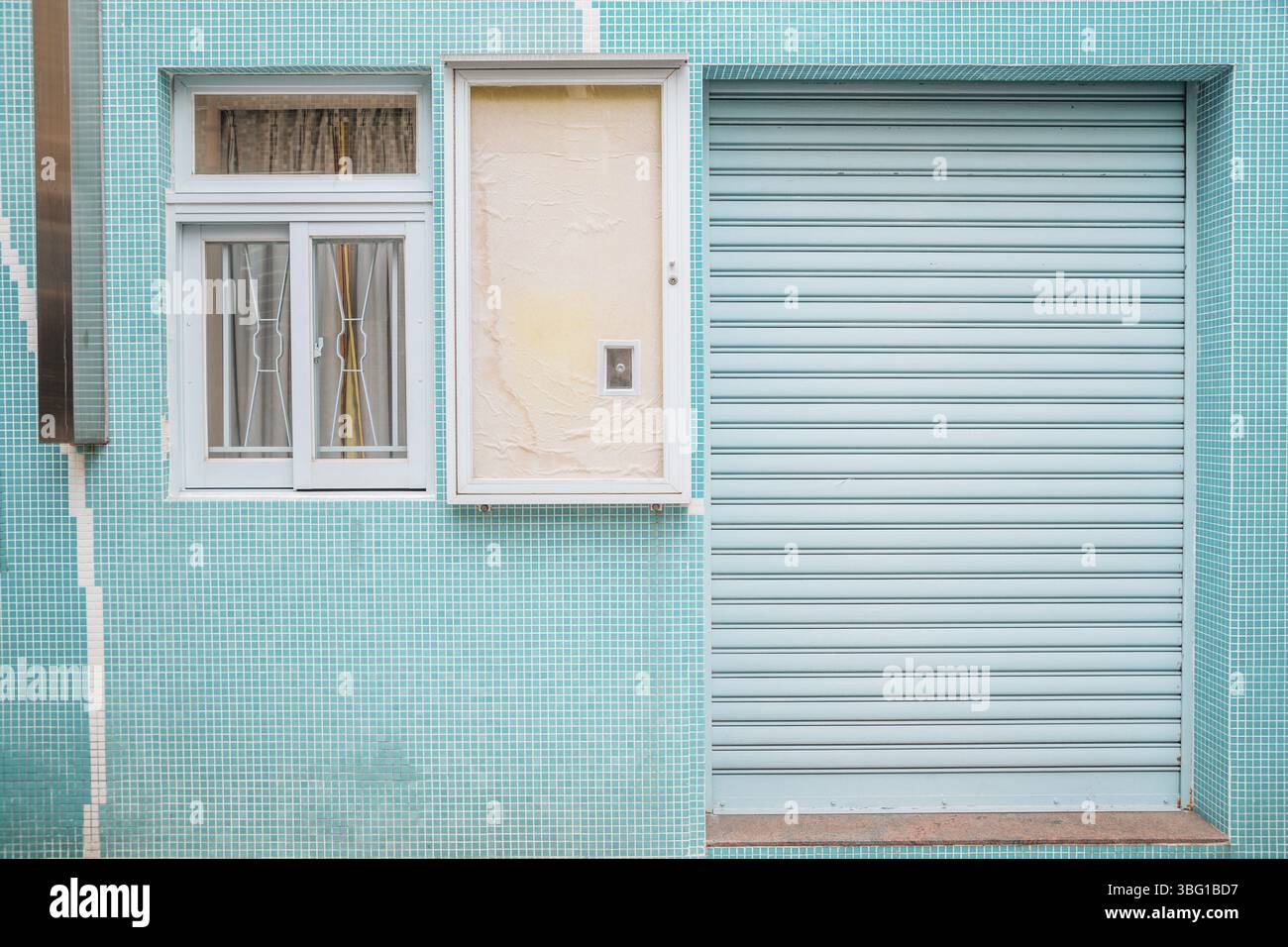 Mint color house wall and shutter door exterior Stock Photo - Alamy