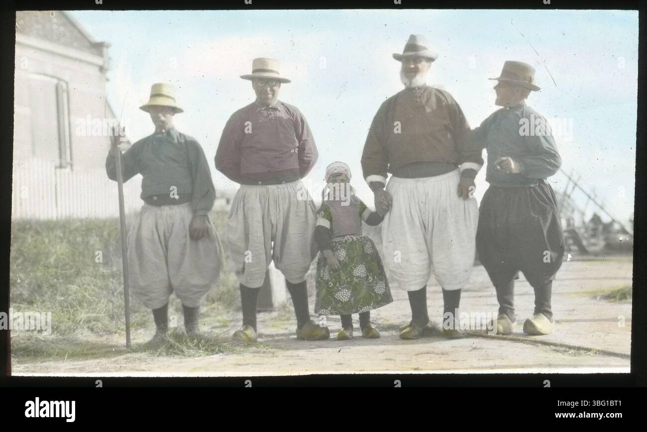 Four men and a girl pose for a photo during the hay harvest in Marken ...