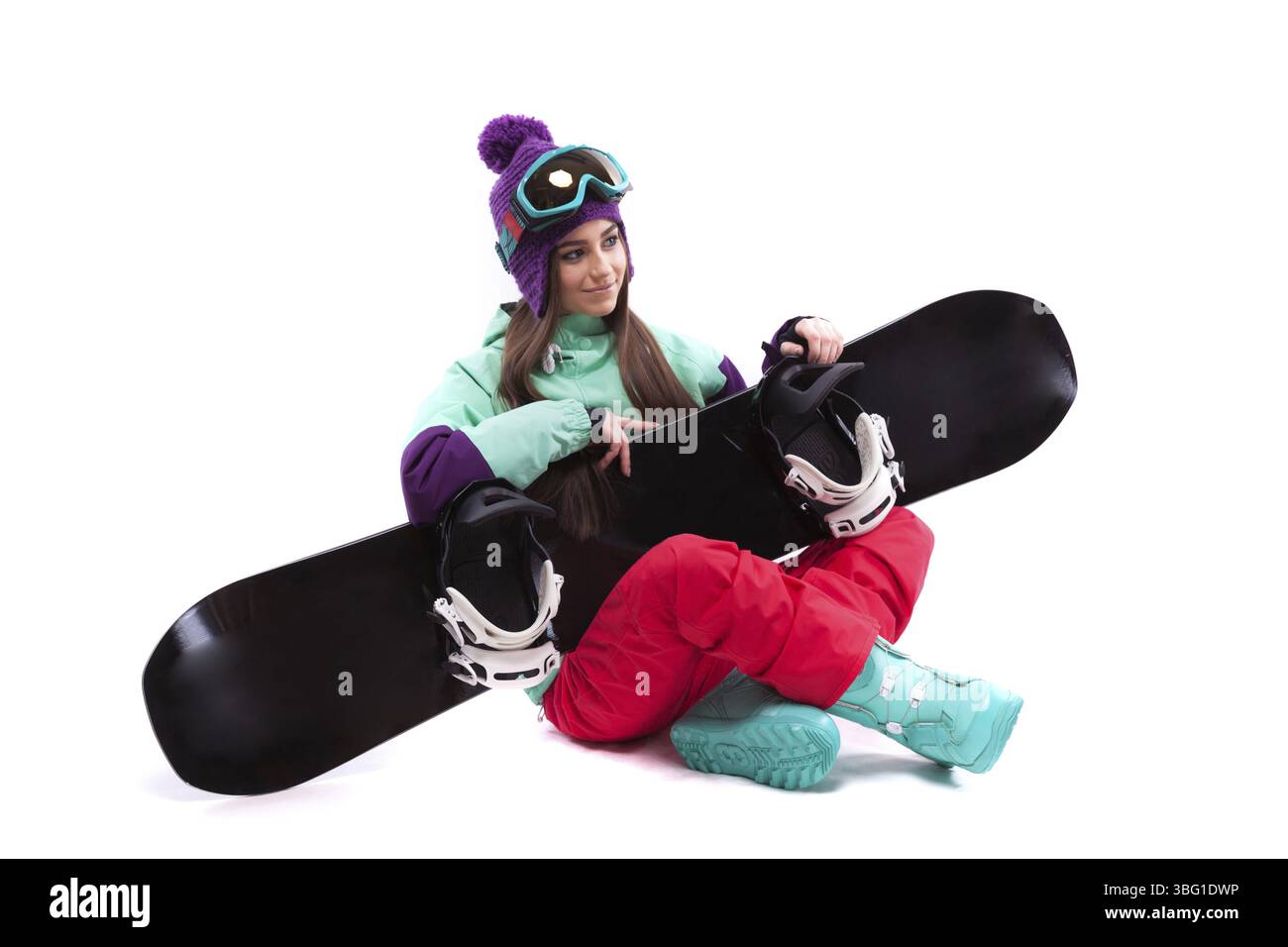 Isolated on white, brunette pretty young caucasian woman in purple ski ...