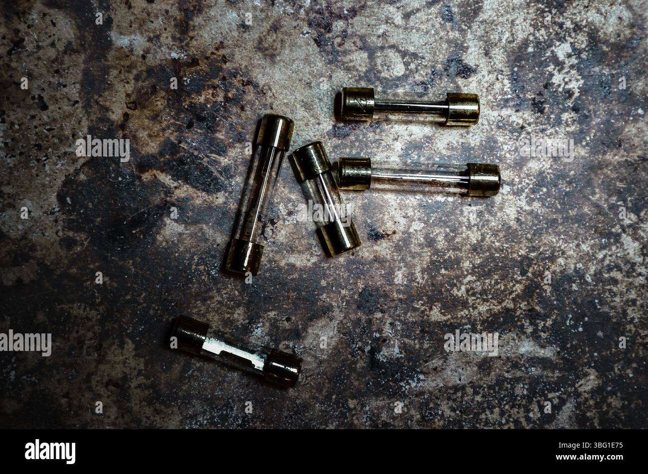 small grouping of automotive fuses on a black and gray background Stock ...