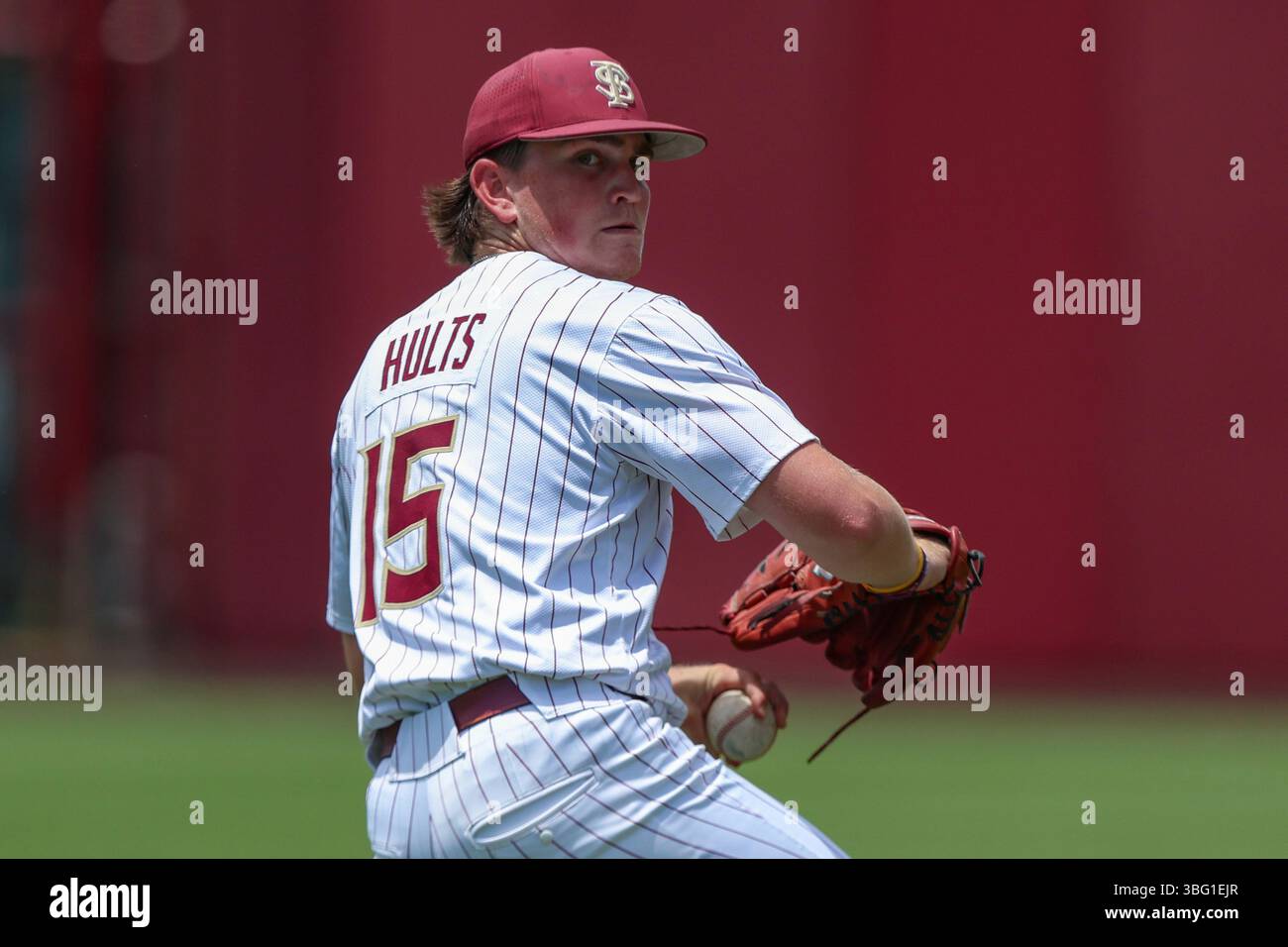 Florida State pitcher Connor Hults (15) warms up before an NCAA ...