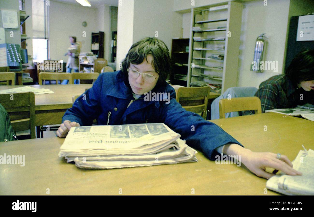 Photograph by A.V. Shirk depicting a student conducting research with ...
