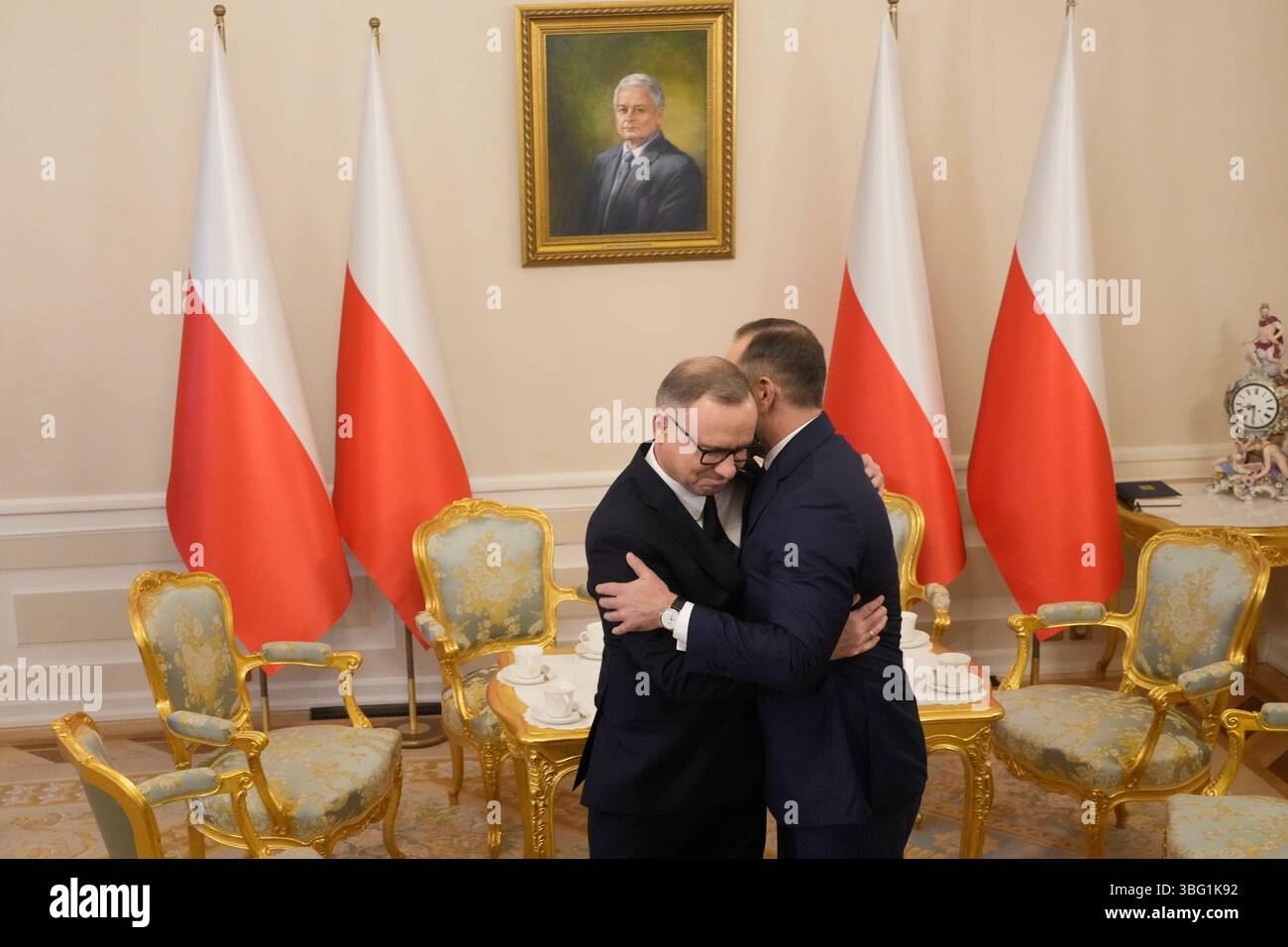 Poland's outgoing President Andrzej Duda, left, welcomes the President Elect Karol Nawrocki at ...