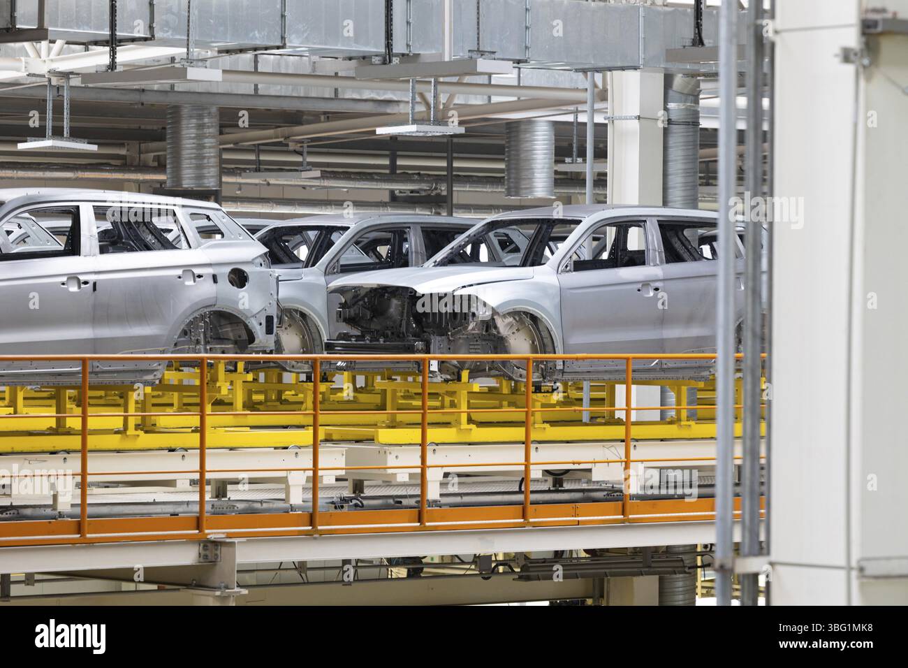 Photo of automobile production line. Modern car assembly plant. Modern ...
