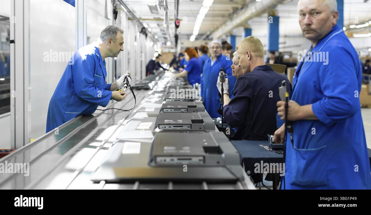 Conveyor for the production of television sets. Testing TVs in the ...