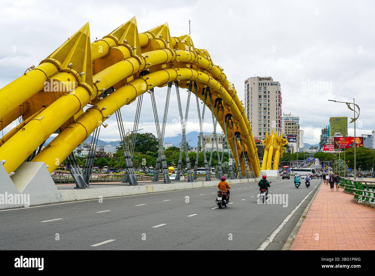 Da Nang, Vietnam-March 18, 2025: Motorbikes Crossing the Iconic Yellow ...