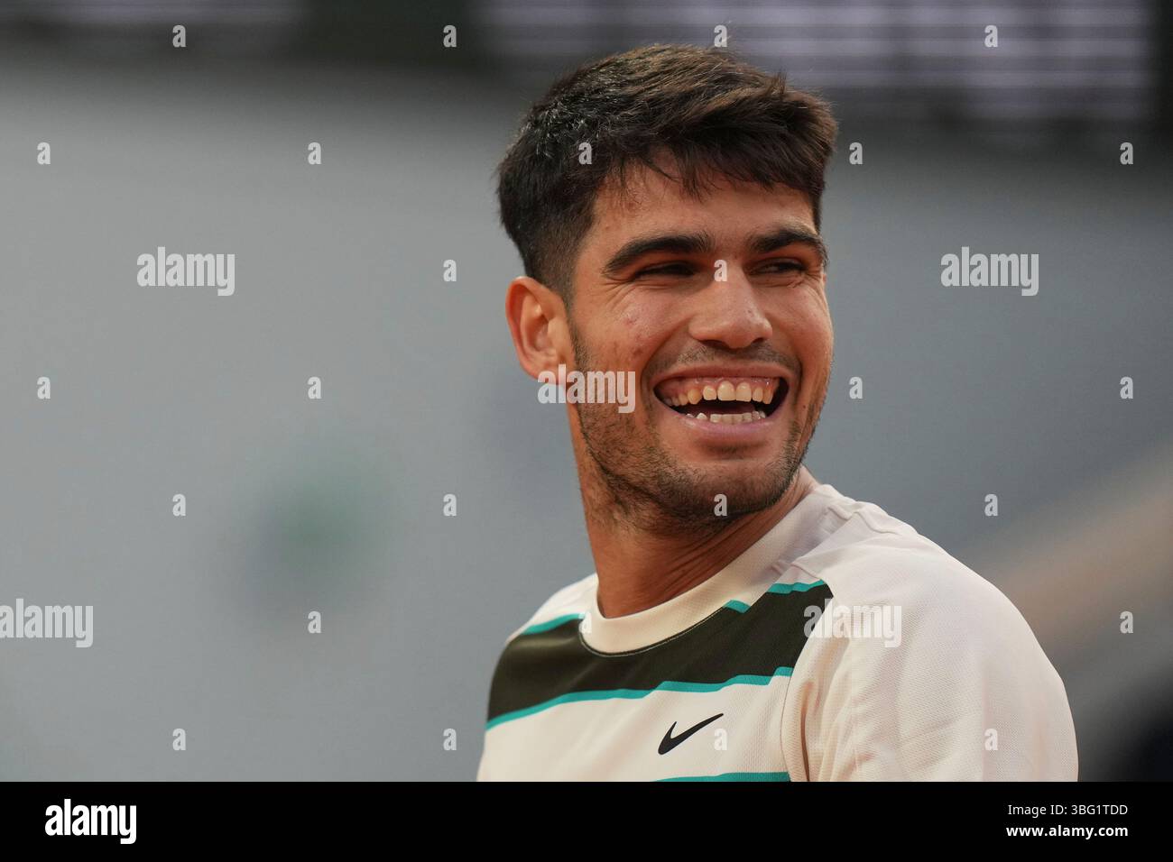 Spain's Carlos Alcaraz smiles as he plays against Tommy Paul of the U.S ...