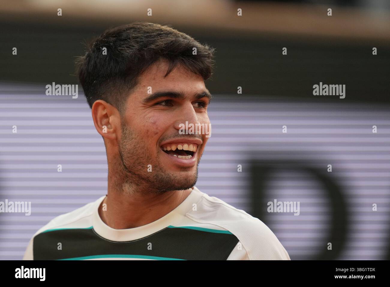 Spain's Carlos Alcaraz smiles as he plays against Tommy Paul of the U.S ...