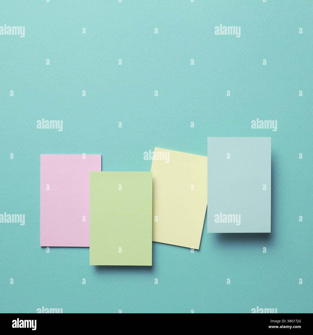 Colorful memo pad, sticky notes on mint background Stock Photo - Alamy