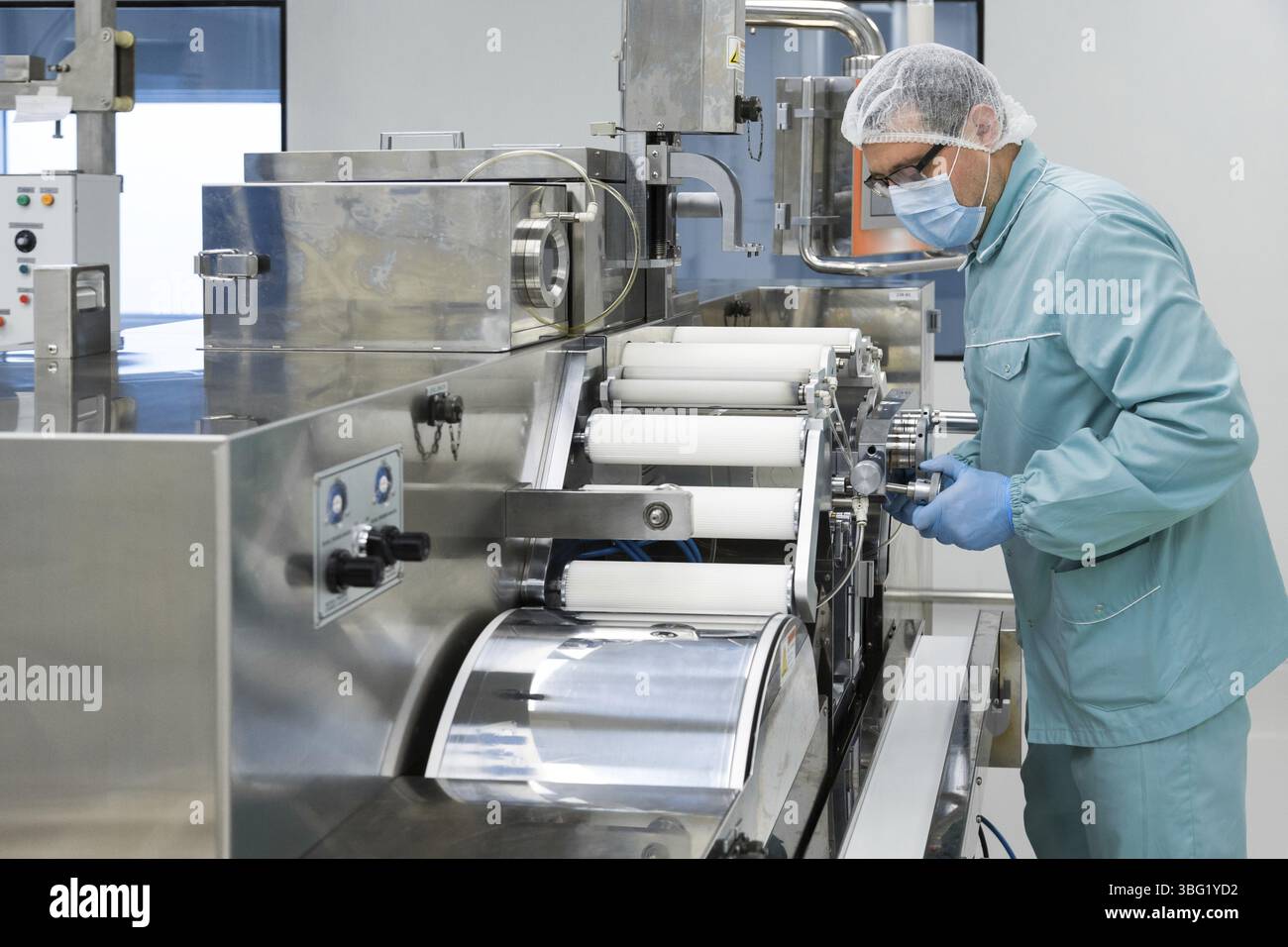 Pharmacy industry factory man worker in protective clothing in sterile ...