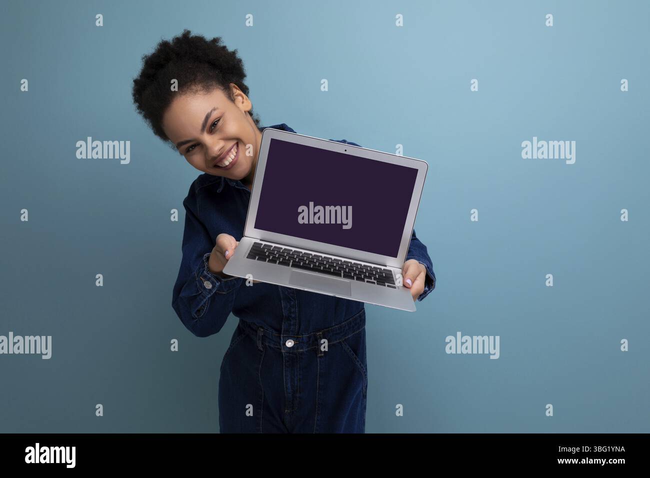 Young joyful hispanic business woman with fluffy hair dressed in blue ...