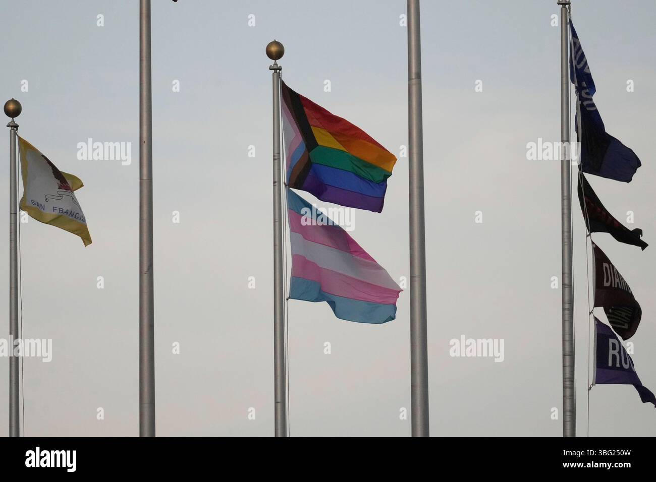 Flags for Pride Month fly at Oracle Park during a baseball game between ...