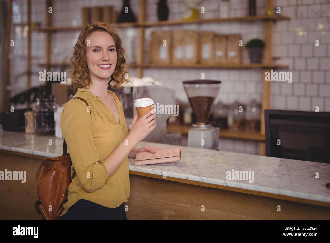 Woman standing marble counter hi-res stock photography and images - Alamy