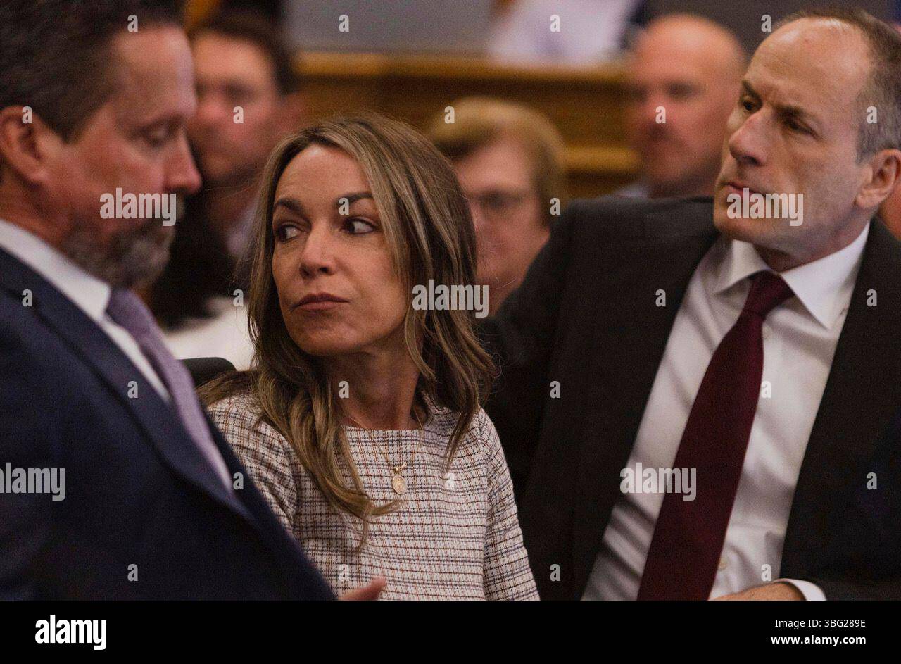 Karen Read sits with members of her defense team, attorneys Alan ...