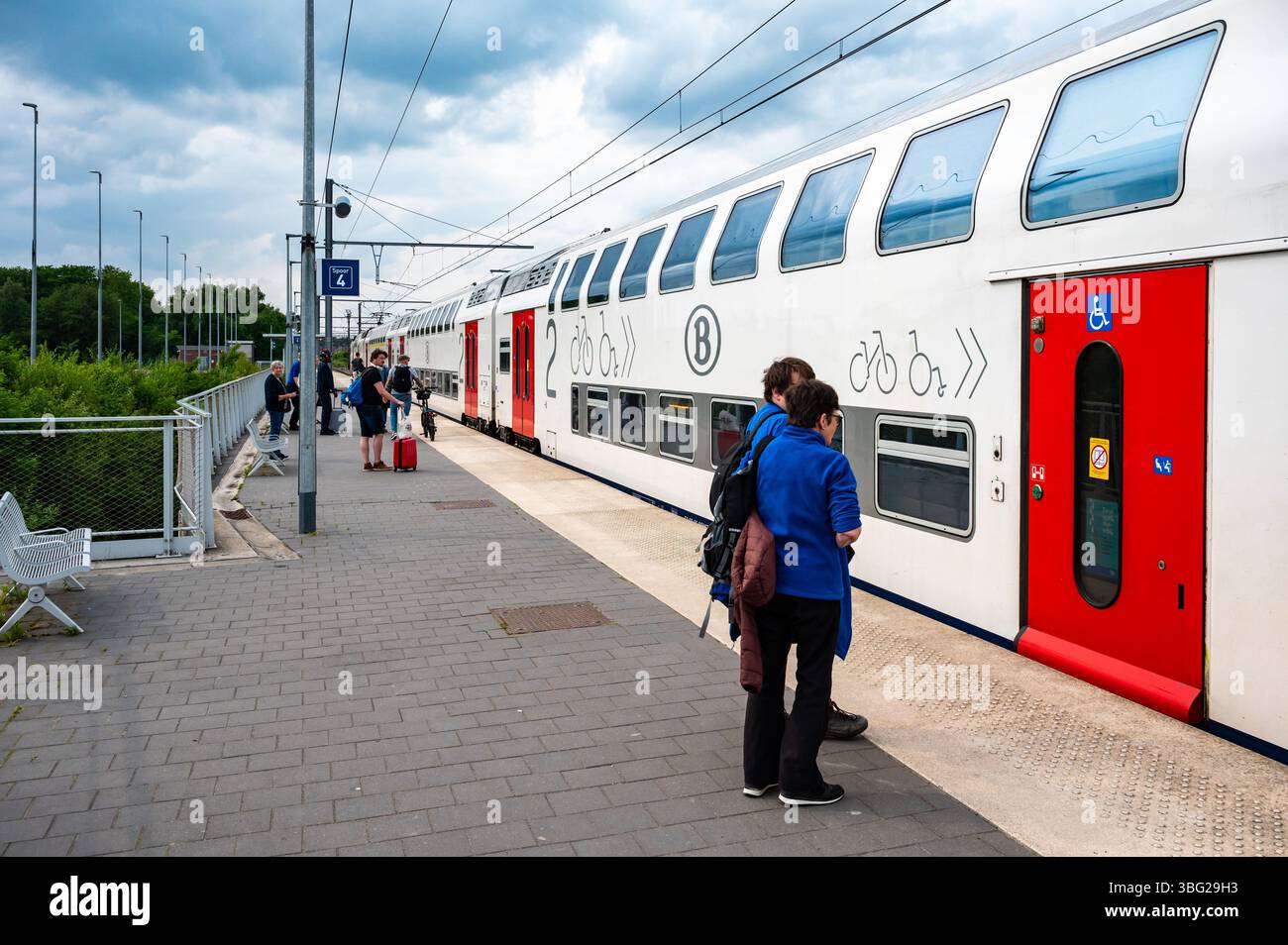 Double deck IC train waiting at the platform in TienenTienen, Flemish ...