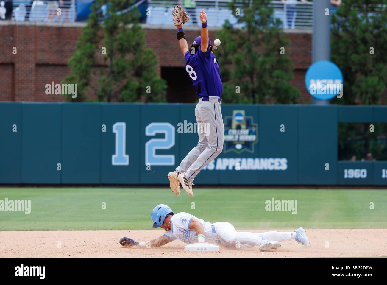 Holy Cross's Brendan Jones (8) jumps to make a catch as North Carolina ...