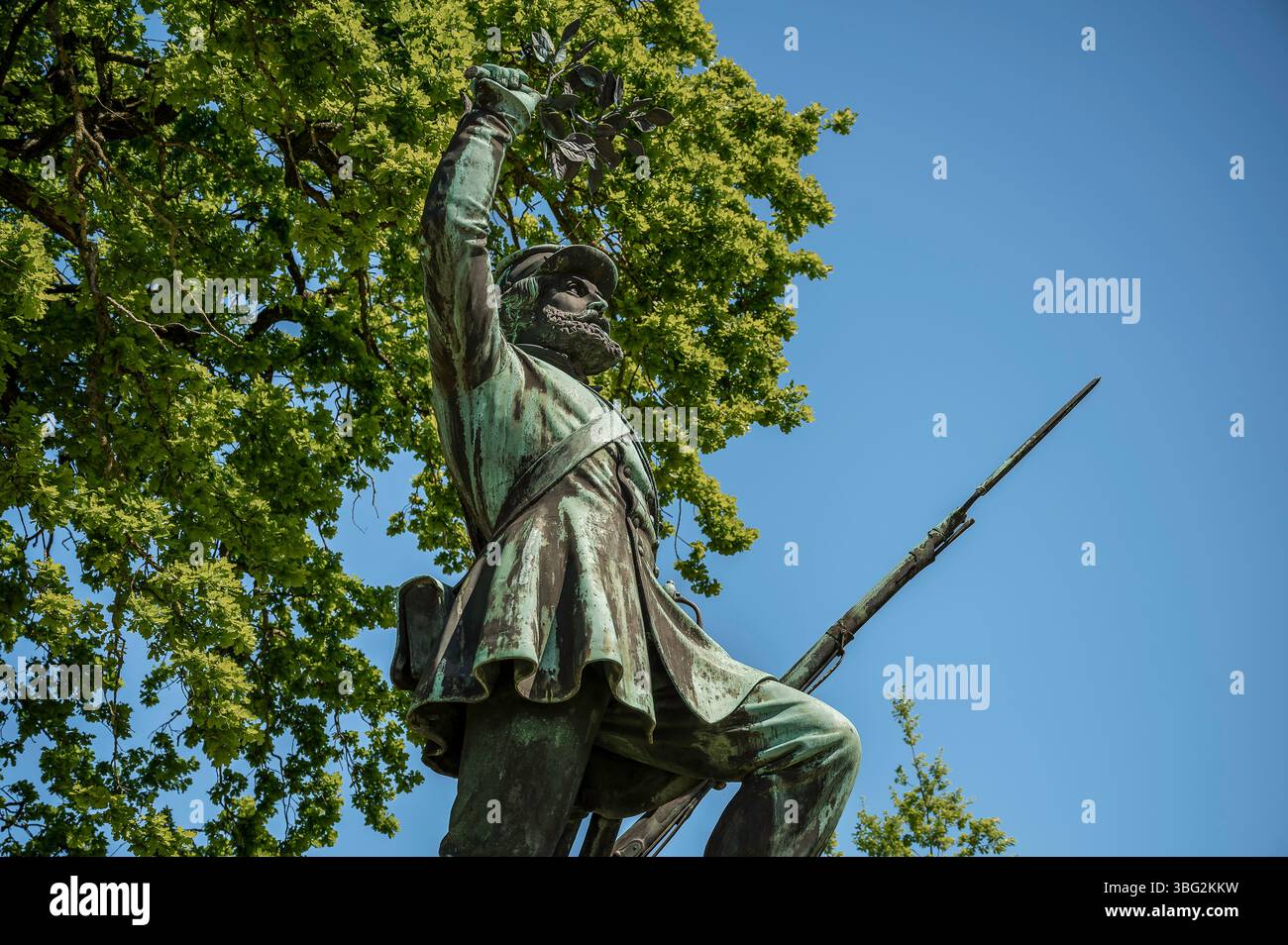 Bronze statue of a 19th-century soldier holding a rifle with bayonet ...