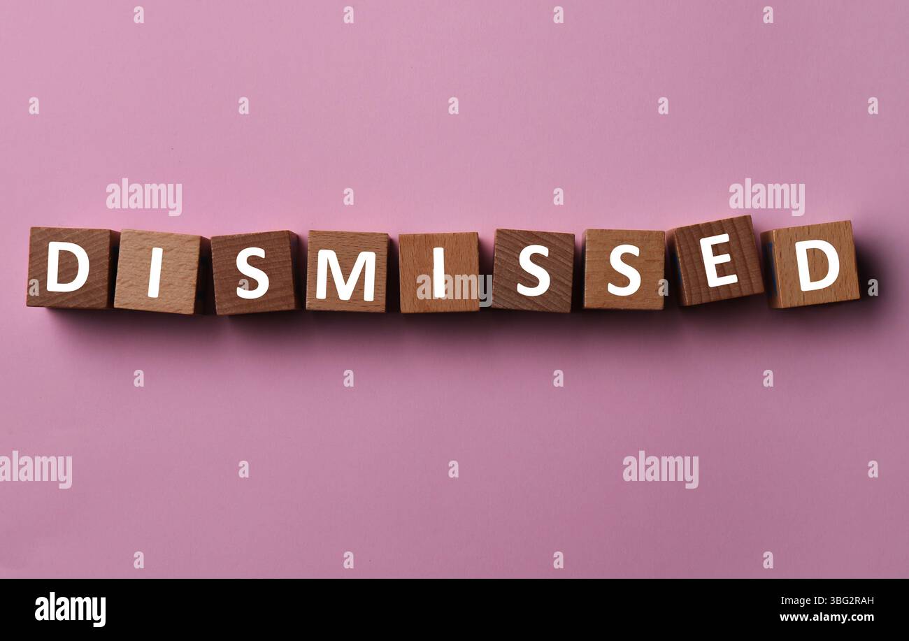 Word Dismissed made of wooden cubes on pink background, top view Stock ...