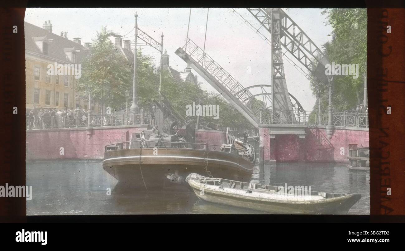A boat passes through a drawbridge over an Amsterdam canal. The Arrases ...