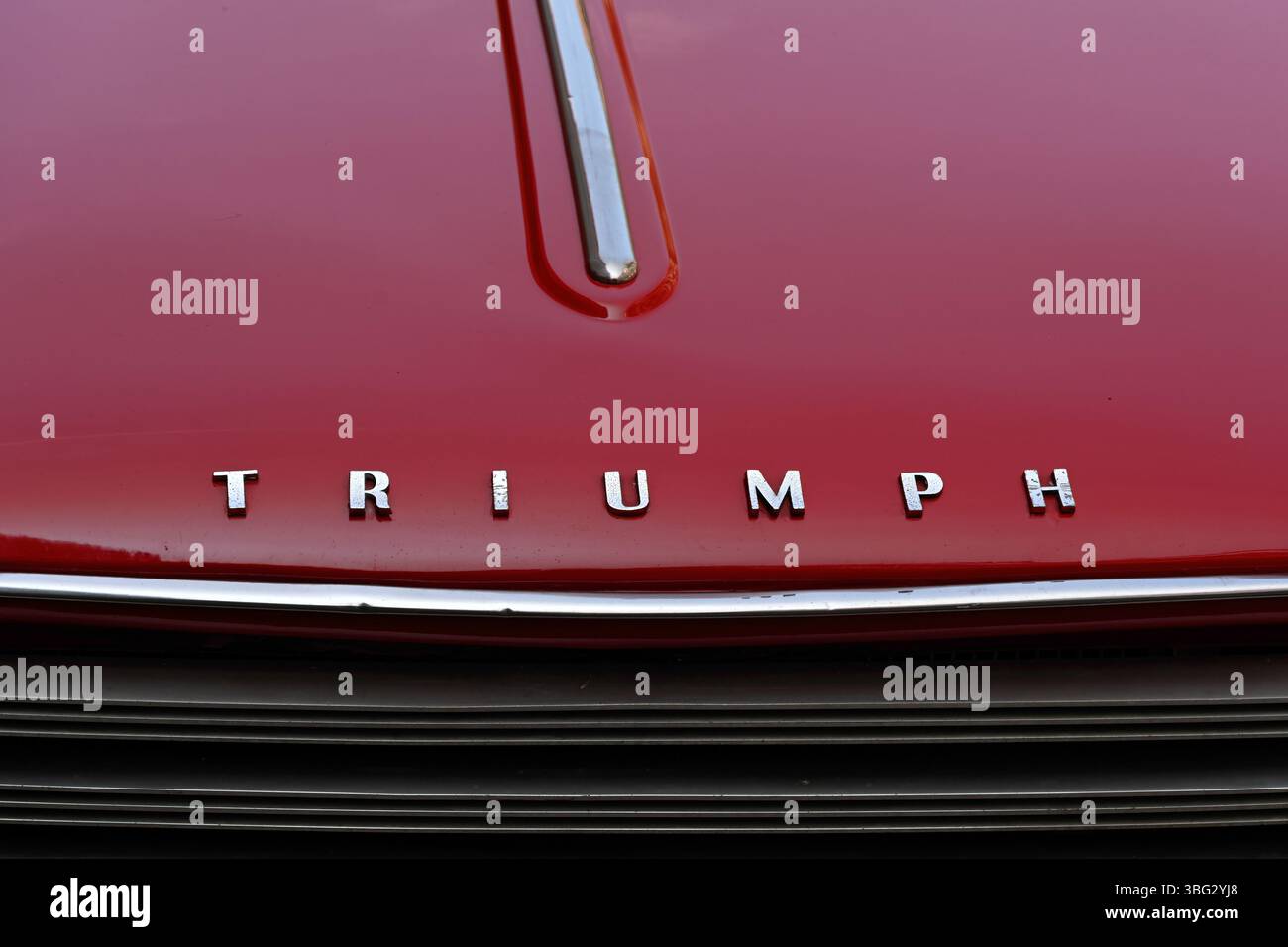 LONDON, UK - MAY 31, 2025: Chrome name of red Triumph Herald ...