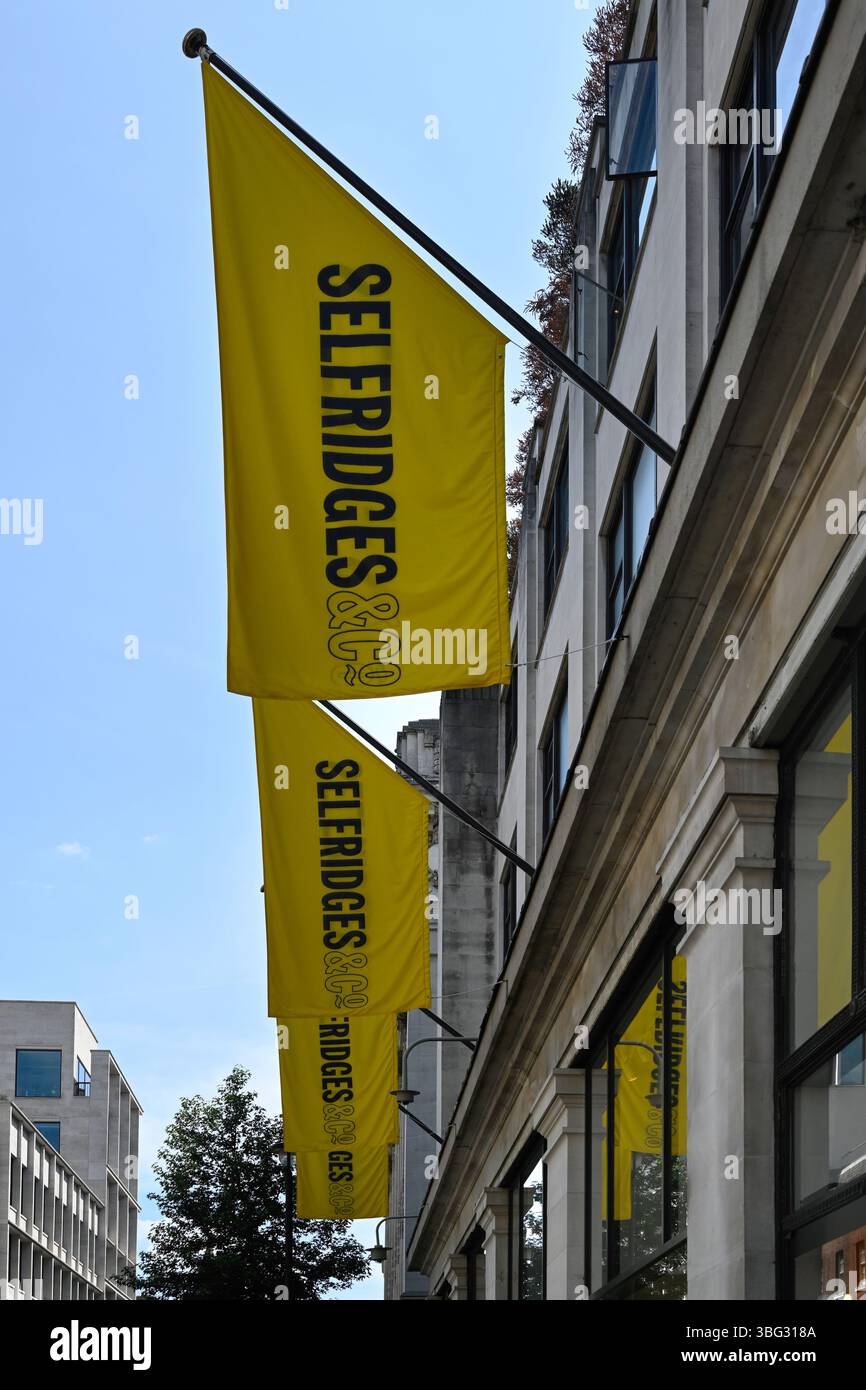 LONDON, UK - MAY 31, 2025: Yellow banner signs outside Selfridges store ...