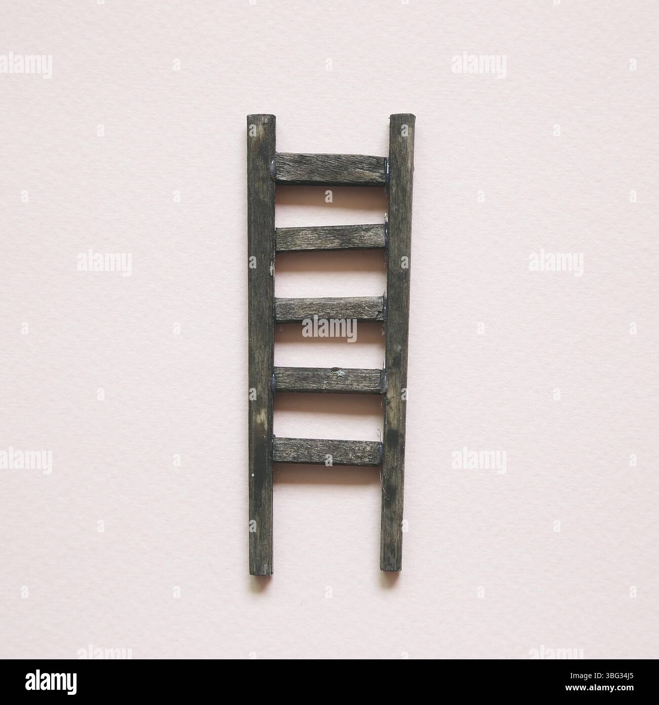 Wooden ladder on pink background Stock Photo - Alamy