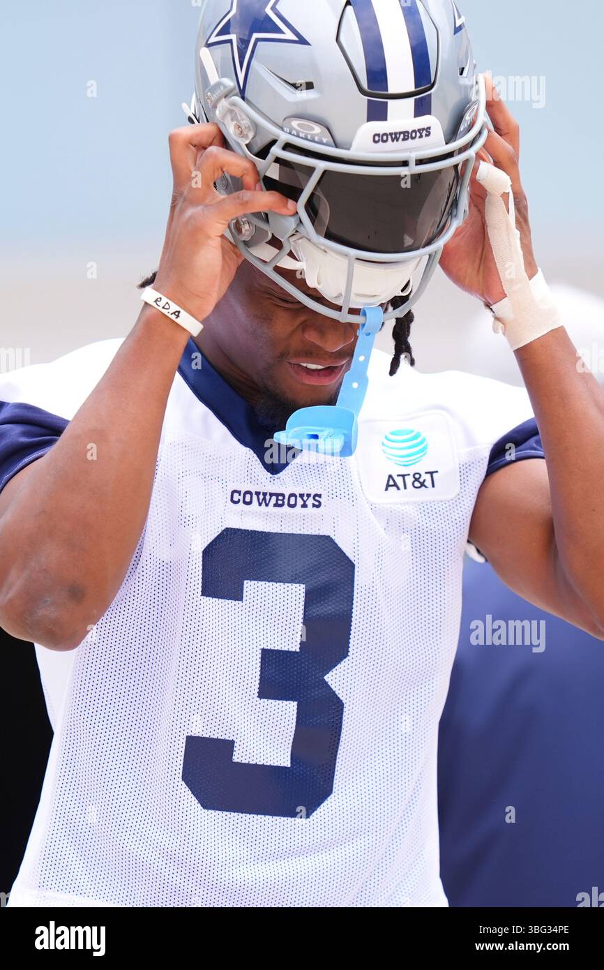 Dallas Cowboys wide receiver George Pickens puts on his helmet for NFL football practice Tuesday ...