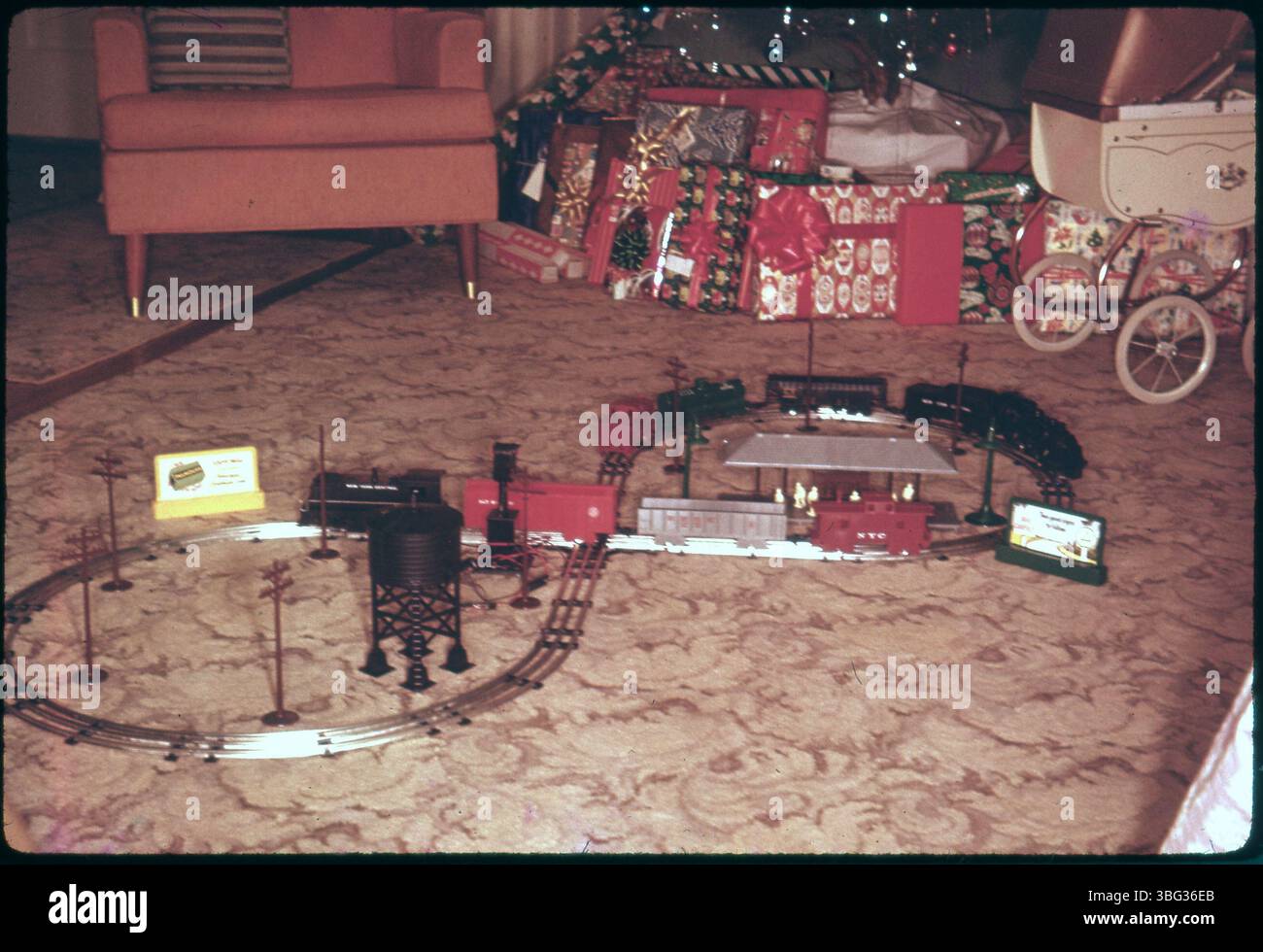 Photograph of a toy train set placed on the floor of the Mosbacher home ...