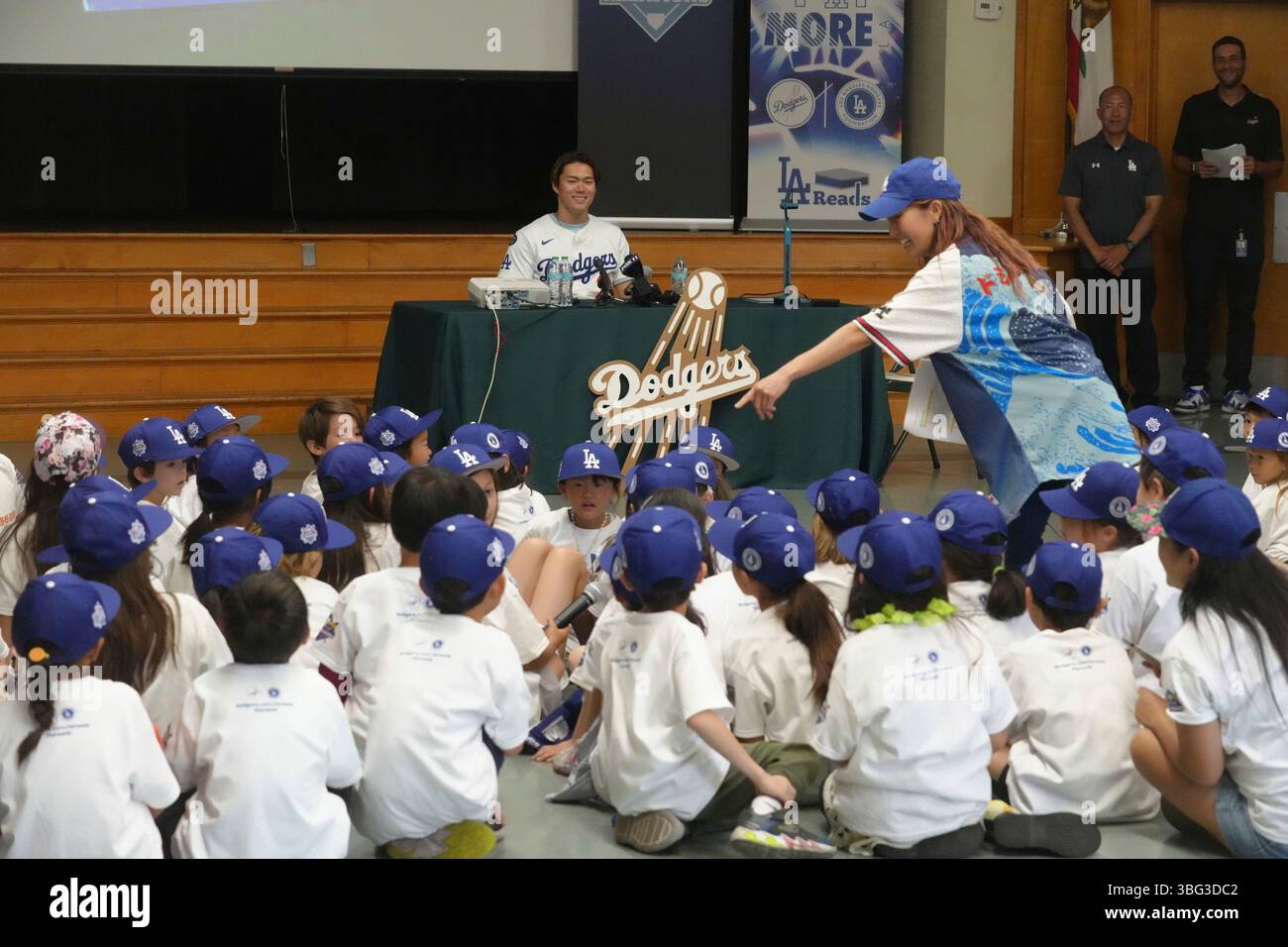 Los Angeles Dodgers pitcher Yoshinobu Yamamoto reads a book in Japanese ...