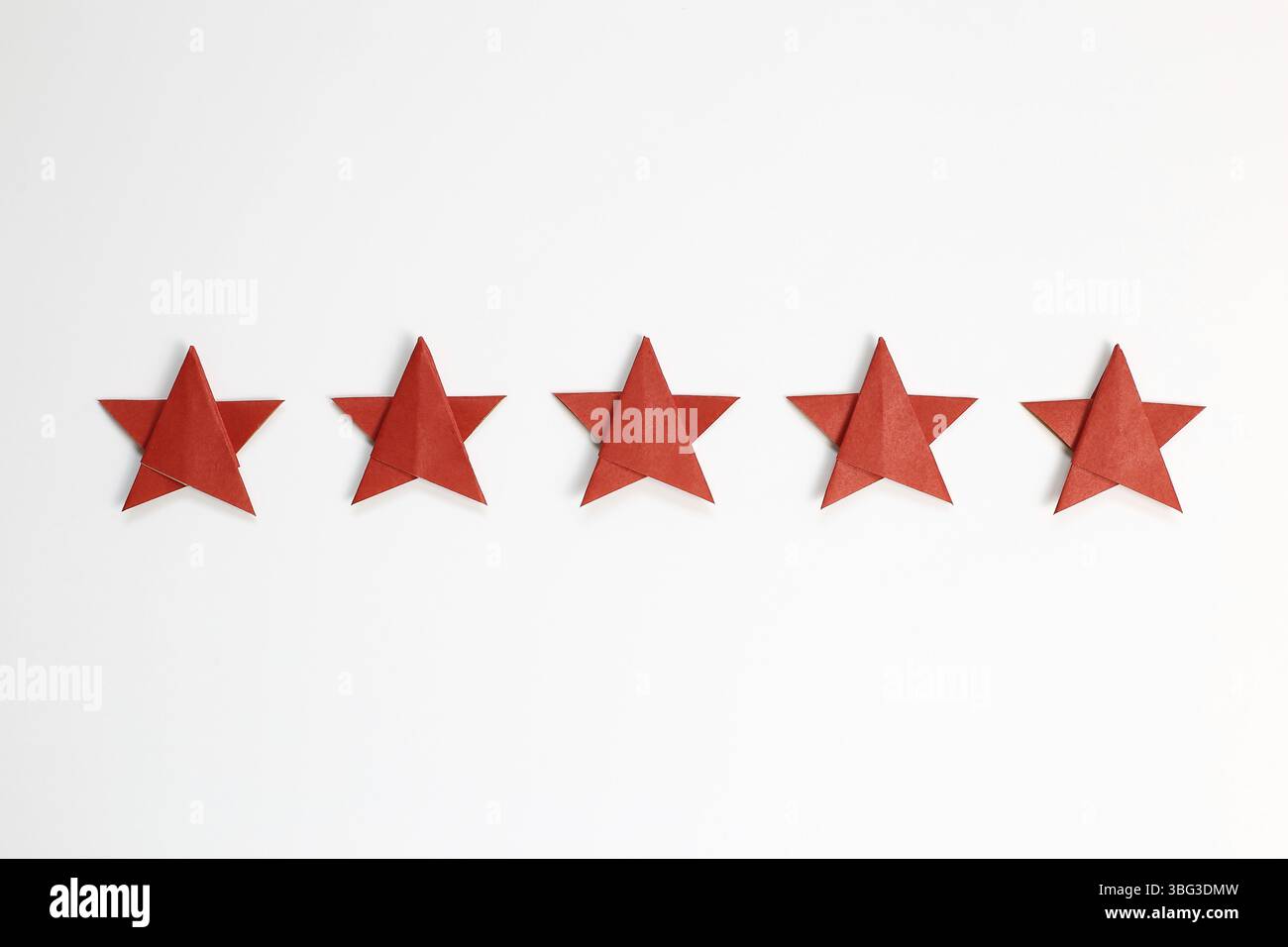 Five stars quality rating on white background Stock Photo - Alamy