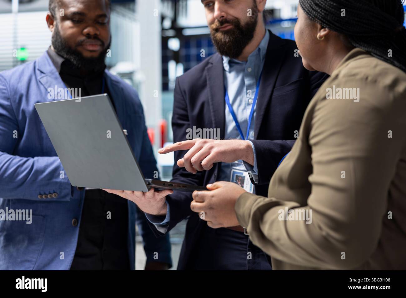 Engineers and building contractor monitoring solar panel systems as ...
