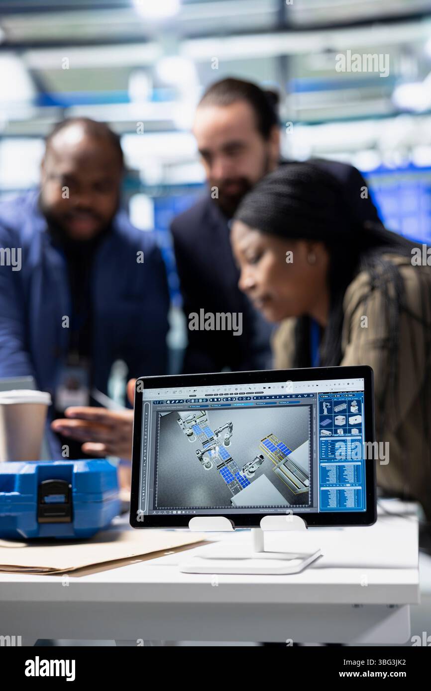 Diverse group of consultants engineers conducting inspection on solar panel performance ...