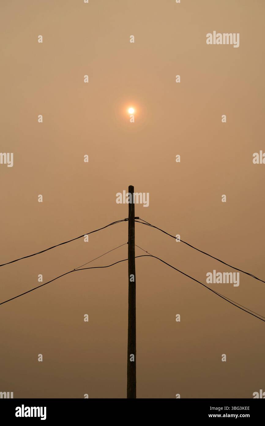 The sun is obstructed by smoke in Norway House, Man., Tuesday, June 3, 2025, at the Norway House ...