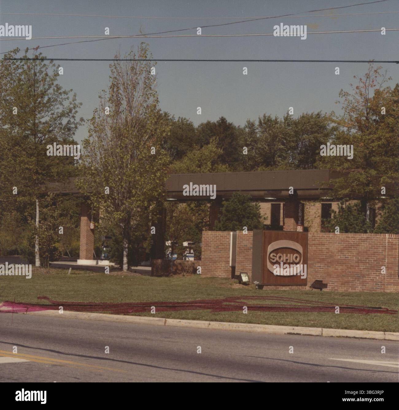 These photographs depict a SOHIO (Standard Oil of Ohio) gas station ...