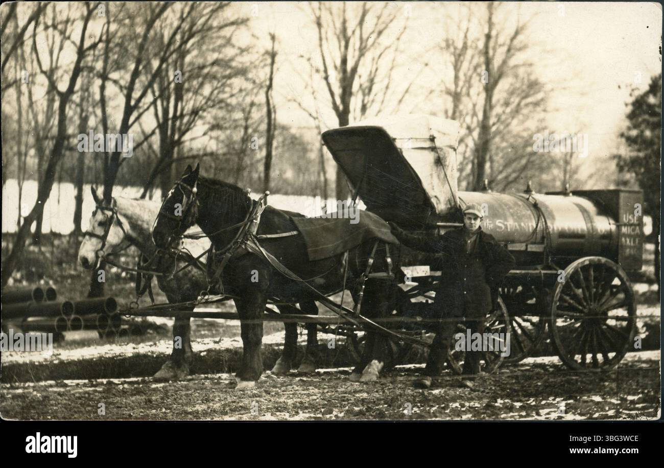 This photograph from circa 1900 shows a male carriage driver in front ...