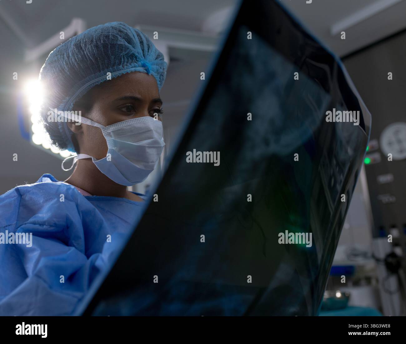 Doctor examining medical film against hi-res stock photography and ...