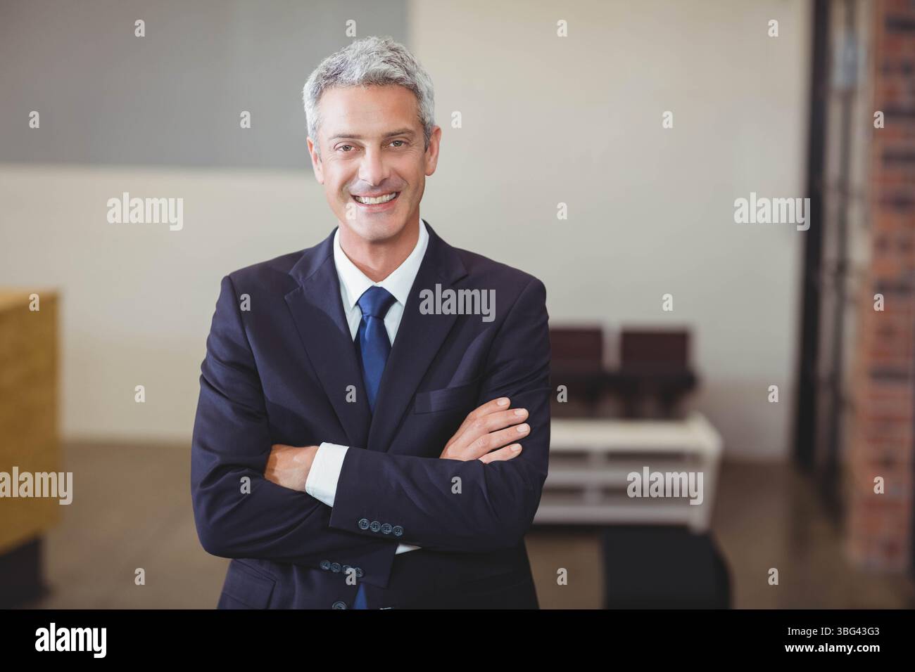 Mustard reception counter sitting beside bench and white table in ...