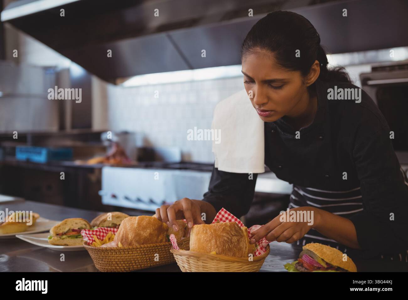 Indian woman chef adding hi-res stock photography and images - Alamy