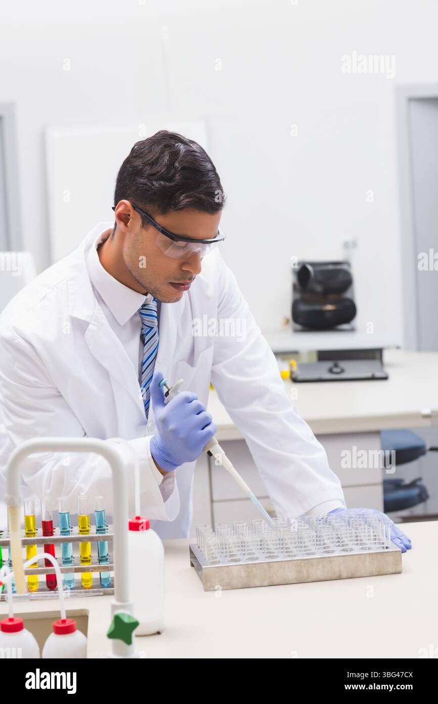 Man scientist using micropipette hi-res stock photography and images ...