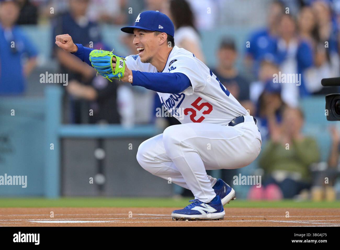 Los Angeles Dodgers' Tommy Edman reacts after his son threw out the ...