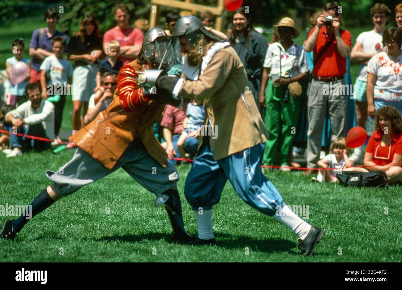 Two participants engage in a fencing demonstration at the 1988 Ohio ...