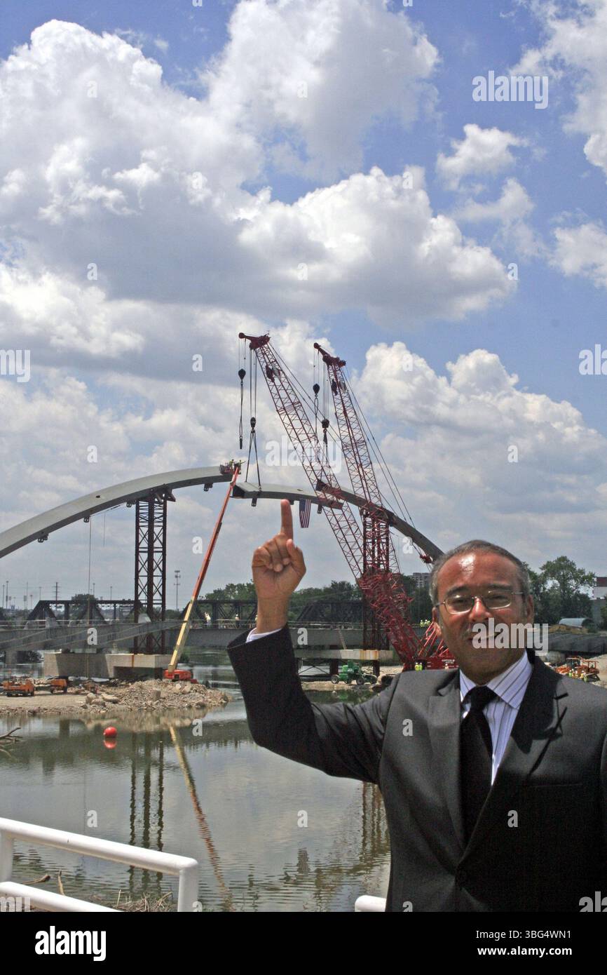 Mayor Coleman is seen lifting a beam during the construction of the ...
